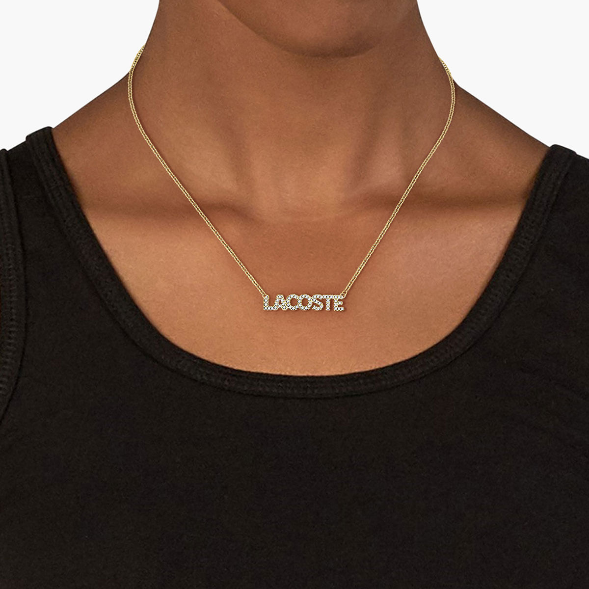 Colgante Lacoste Script de acero dorado 2040061 - Style Store